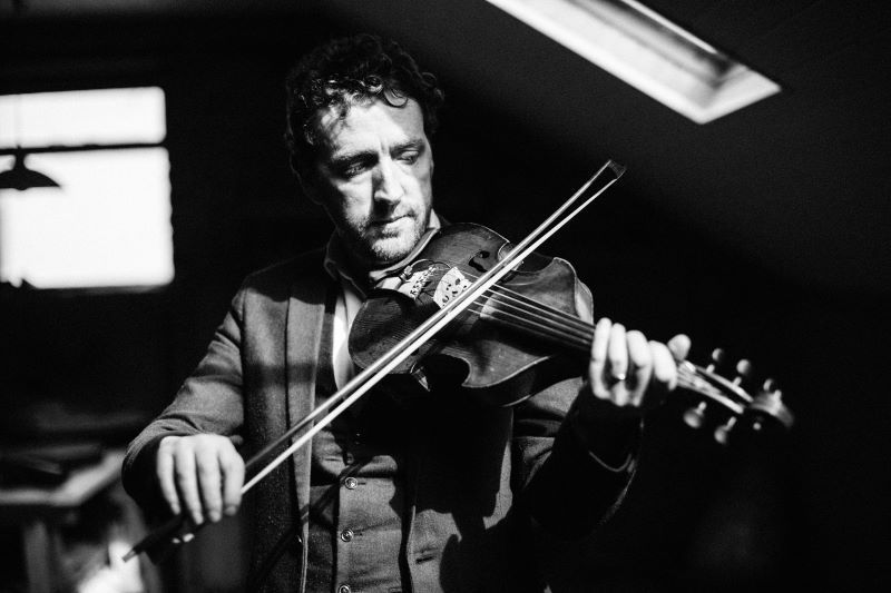 Irish fiddle player Colm Mac Con Iomaire performs live today