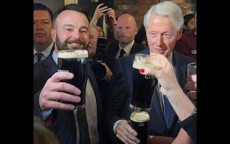Bill Clinton raises a pint in Derry after Hume Foundation address