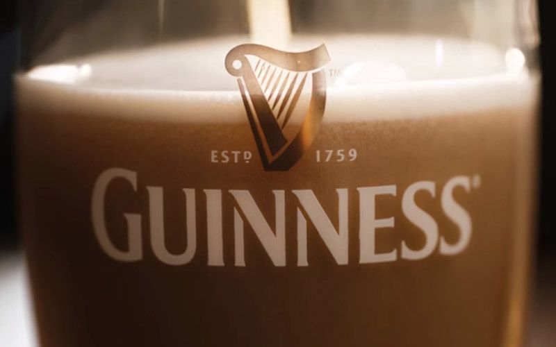 Why do Guinness bubbles go down instead of up?